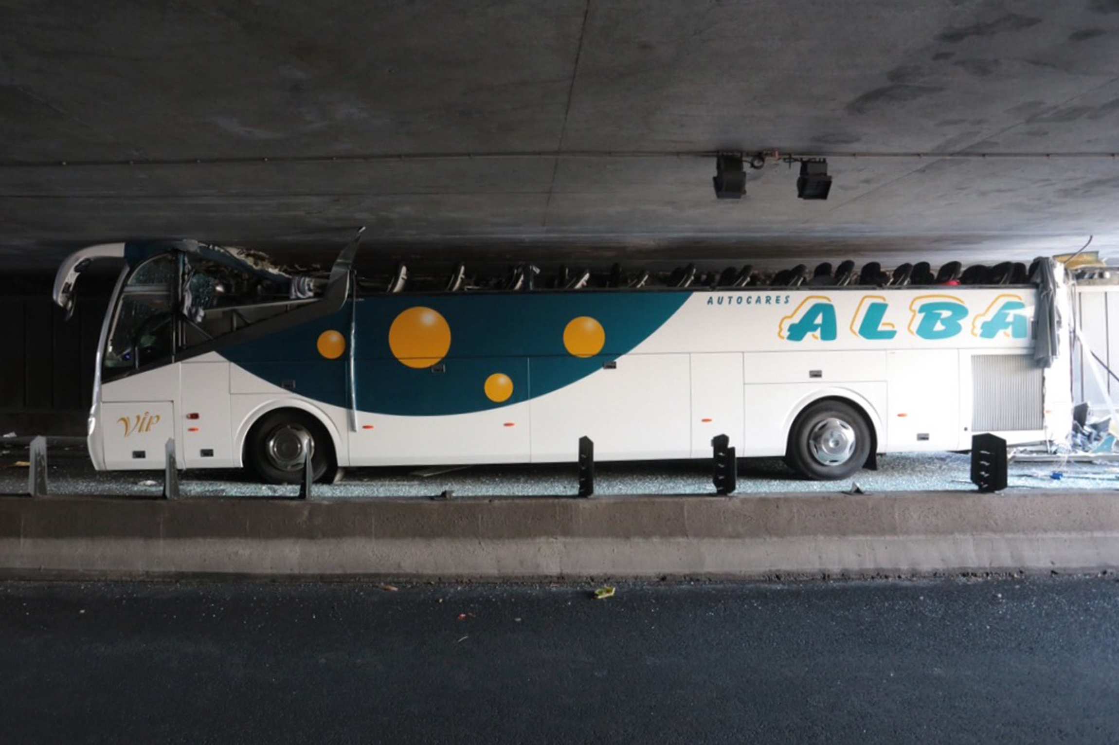 Six seriously injured as bus roof ripped off while passing under low ...