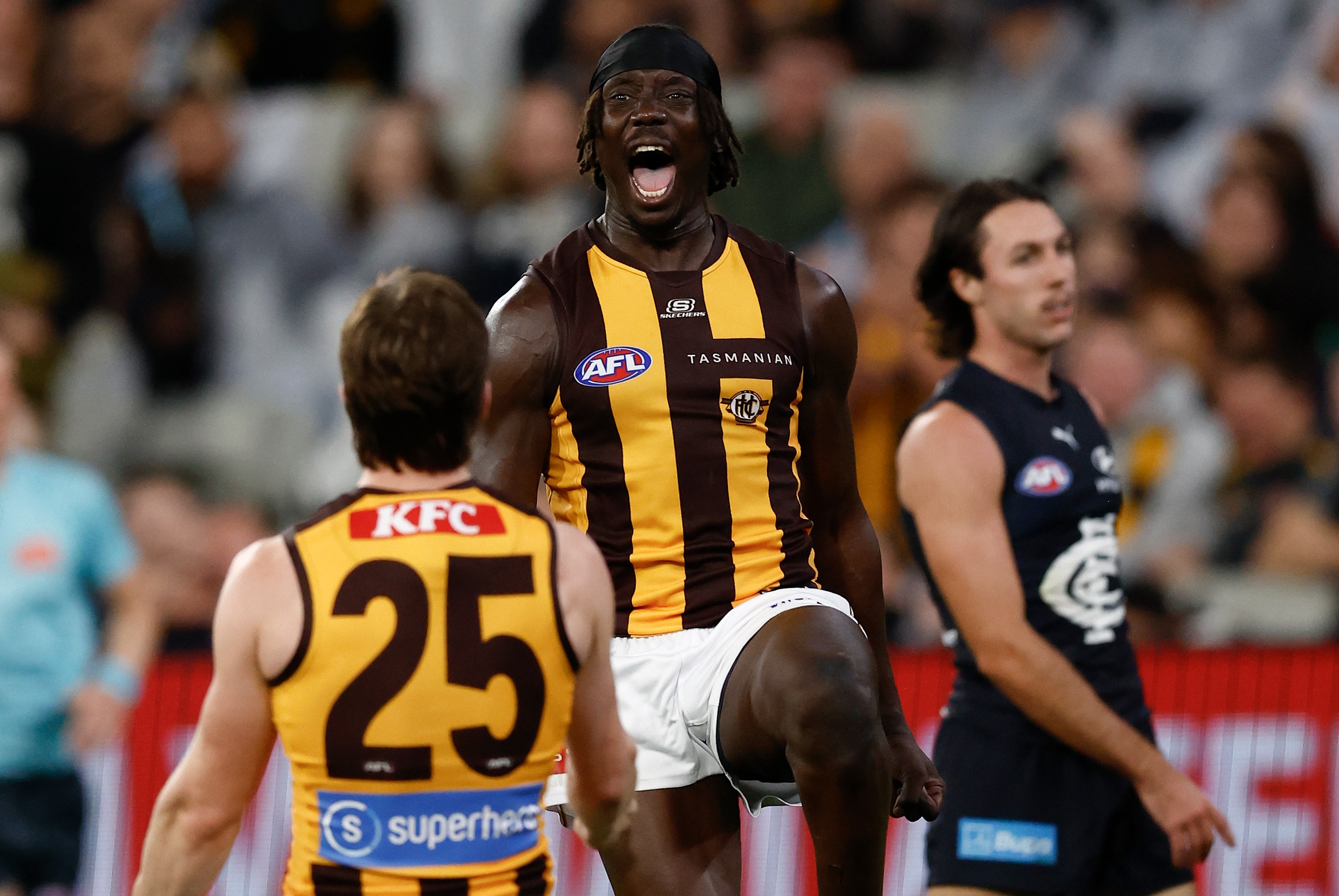 Hawks defeat Blues in bruising AFL blockbuster at MCG to remain ...