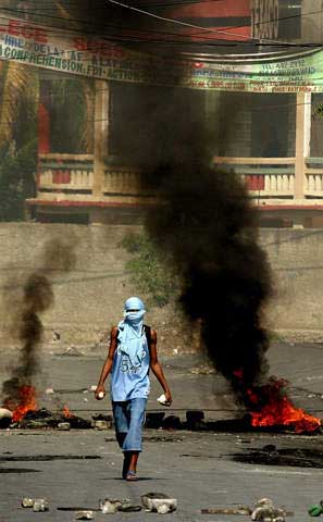 Aristide urges calm after gangs rampage in Haiti - ABC News