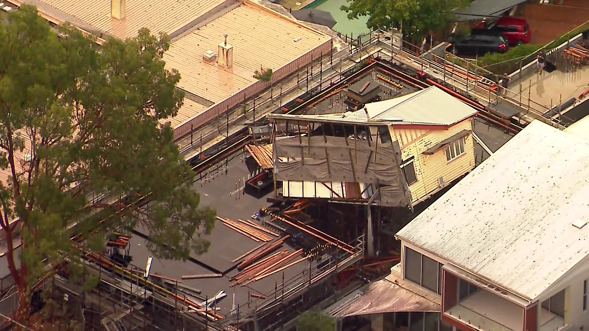 In Highgate Hill, a house under renovation toppled off its stilts ...
