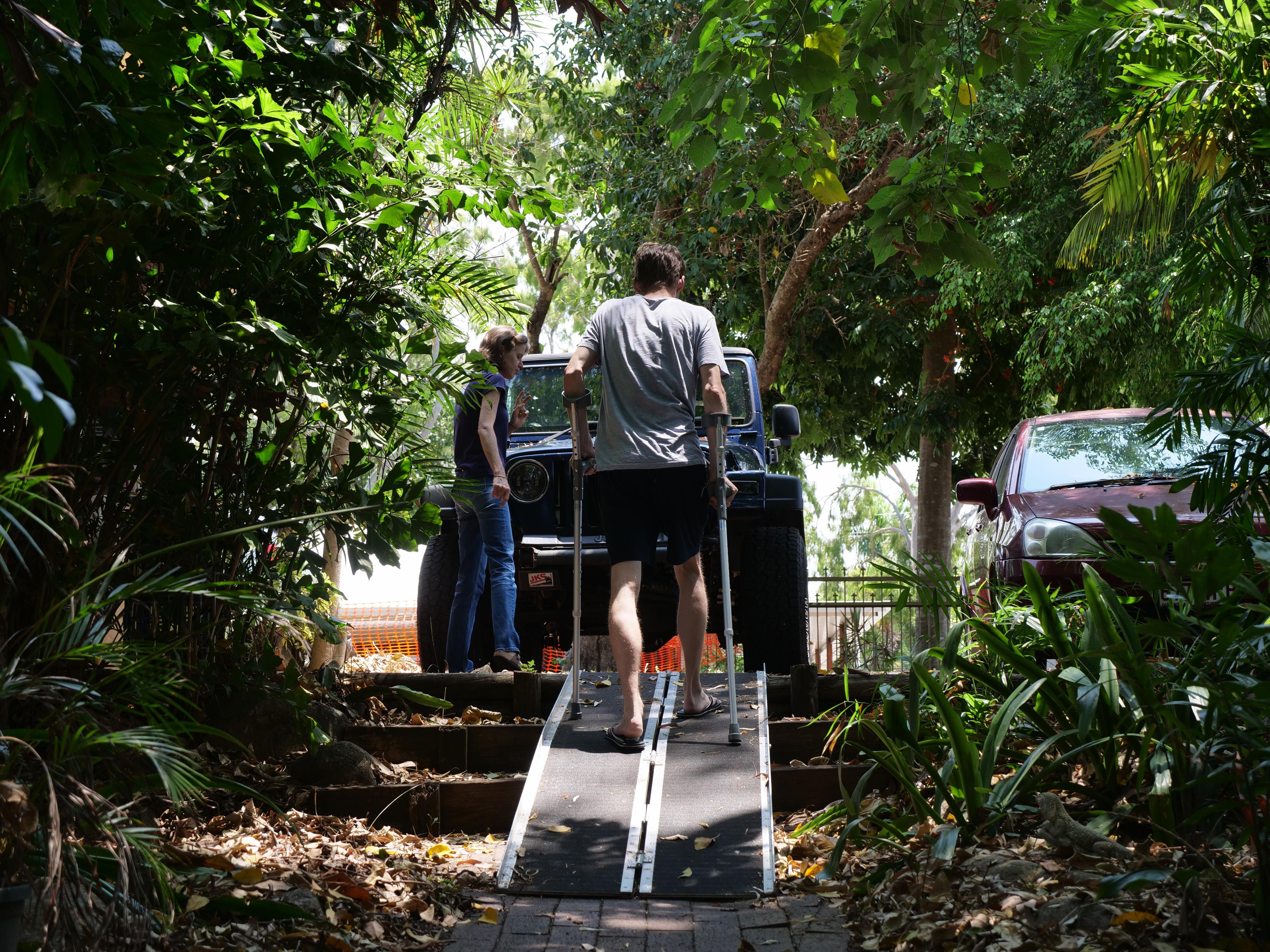 Mackay man put in wheelchair for months by rare case of myelitis likely ...