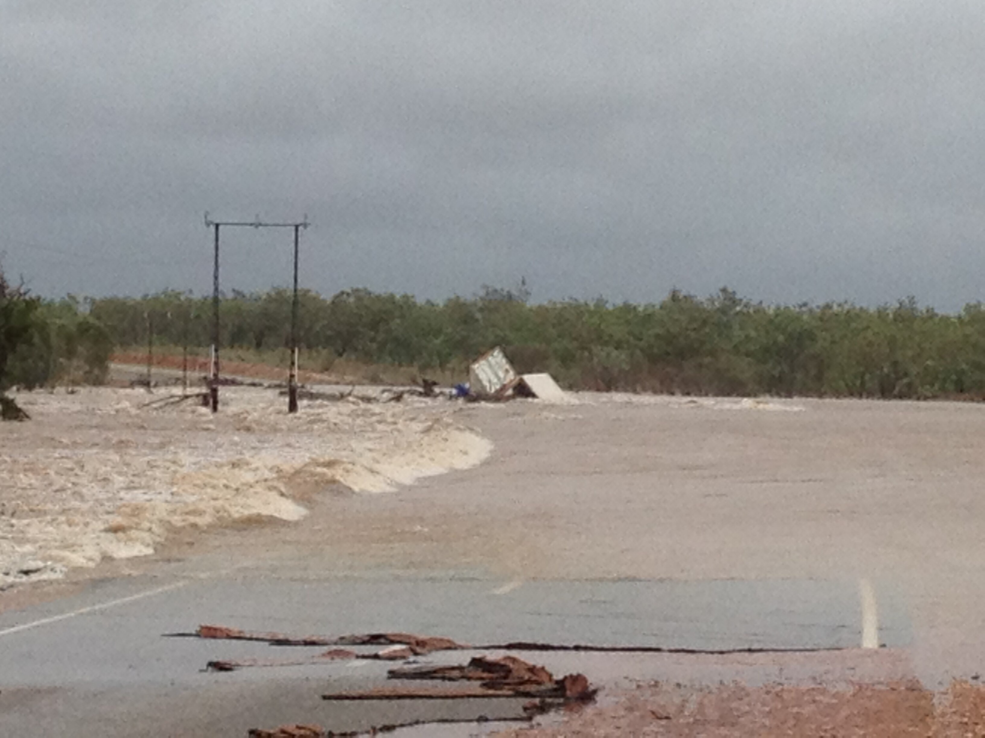 Two injured after train derails in cyclone flooding - ABC News