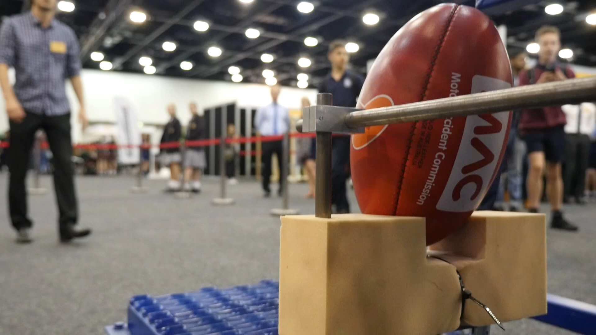 Nicholas Scalzi catches a football kicked from their automated kicking ...