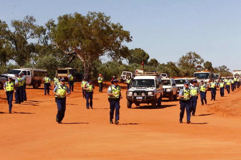 Police protect Woodside convoy as work resumes - ABC News