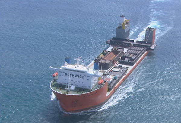 Dredge ship unloads in bay - ABC News