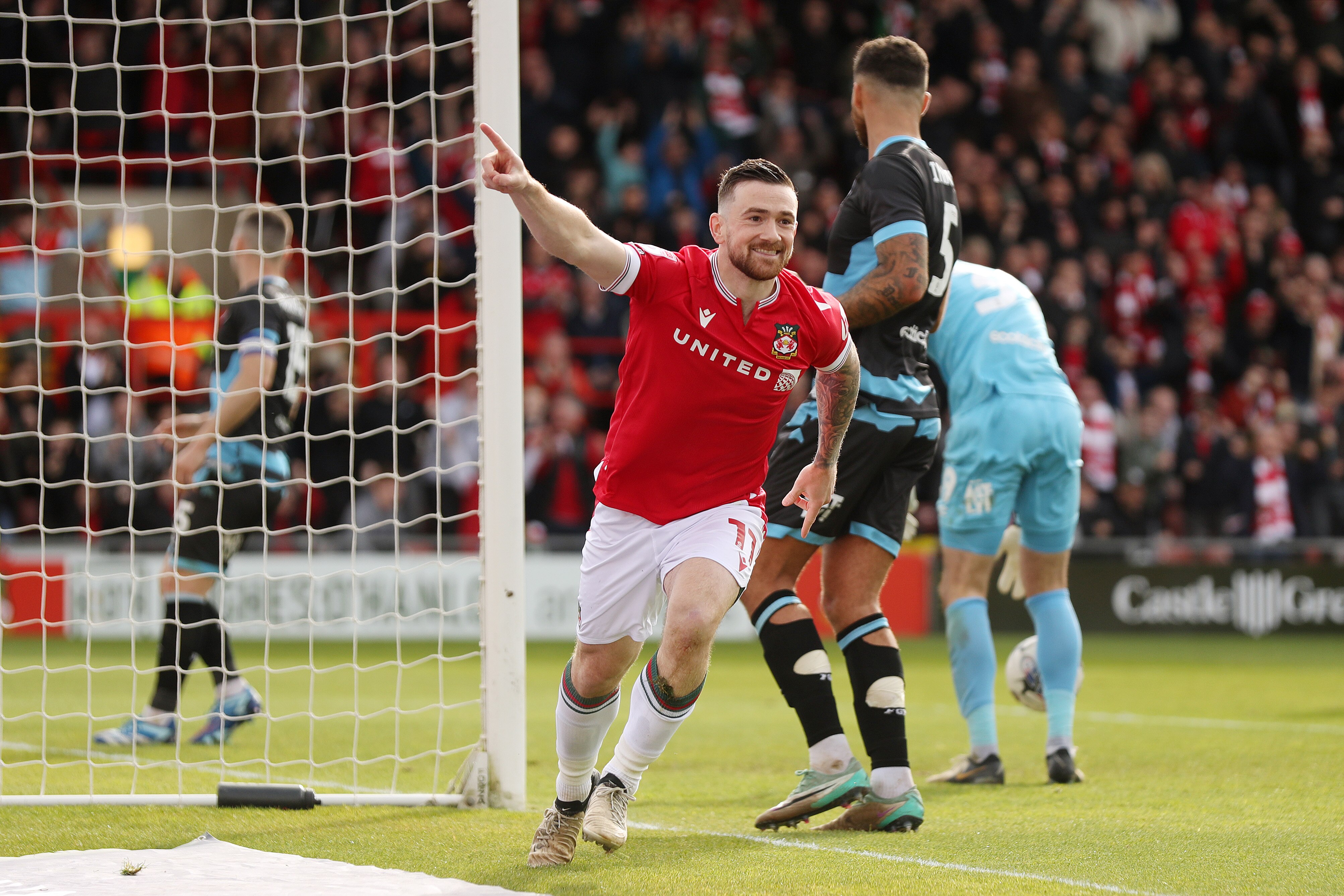 Co-owner Ryan Reynolds celebrates Wrexham promotion to third-tier as ...