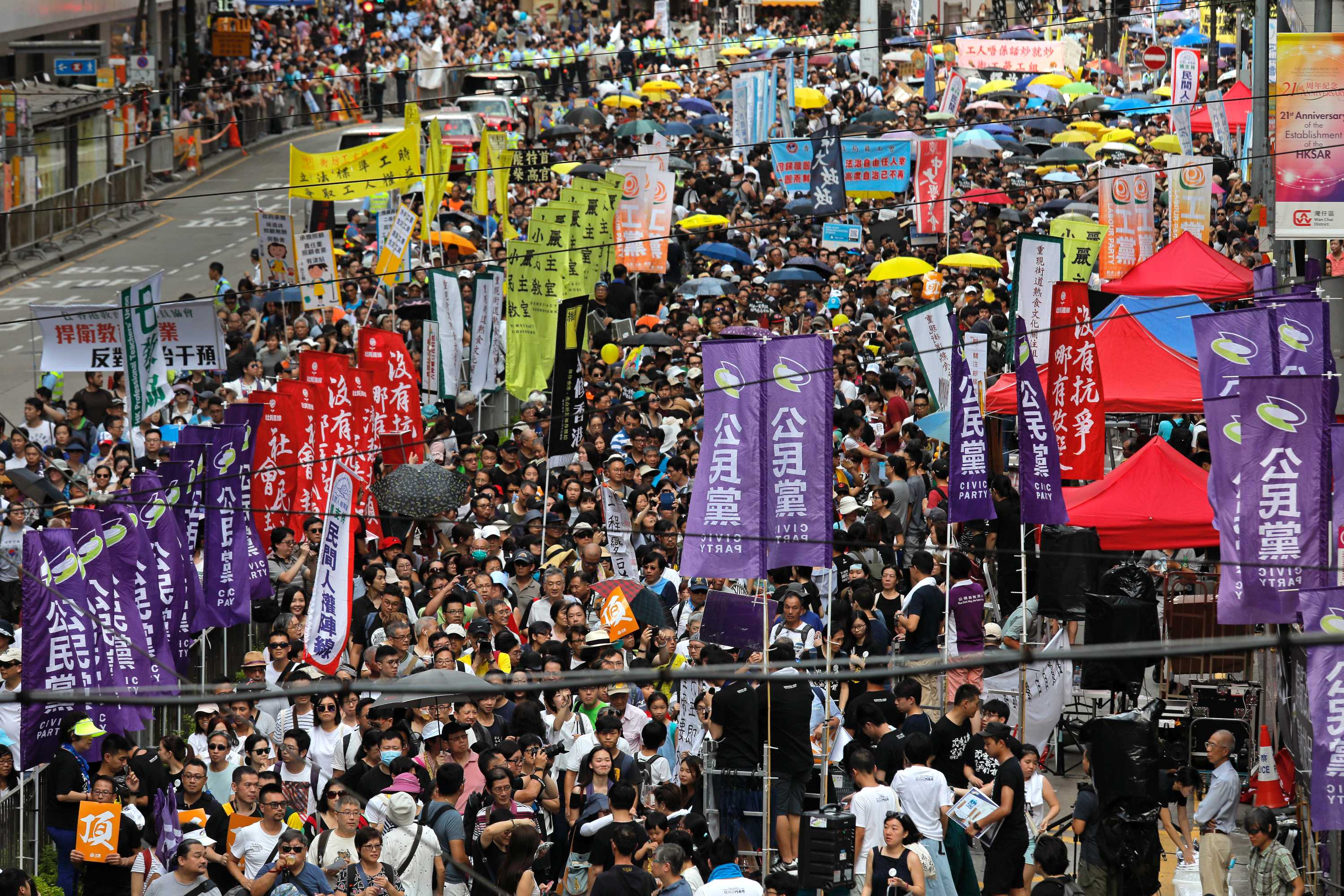 Hong Kong pro-democracy protests draw low turnout, 21 years after ...