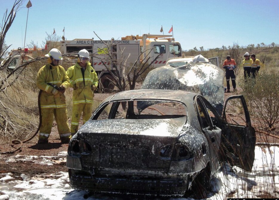 Unconscious driver pulled from burning car - ABC News