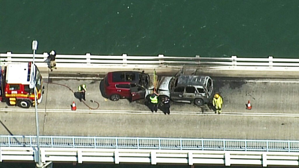 Fiery crash on Bribie Island bridge injures three people, causes ...