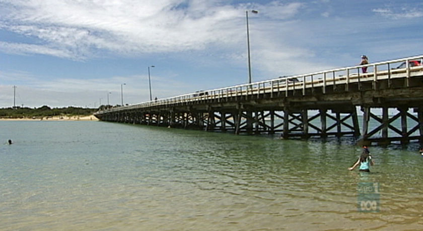 Thousands gathered at the historic wooden bridge at Barwon Heads to try ...