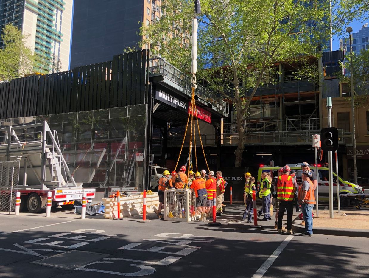 Crane driver suffers suspected spinal and leg injuries after fall at ...