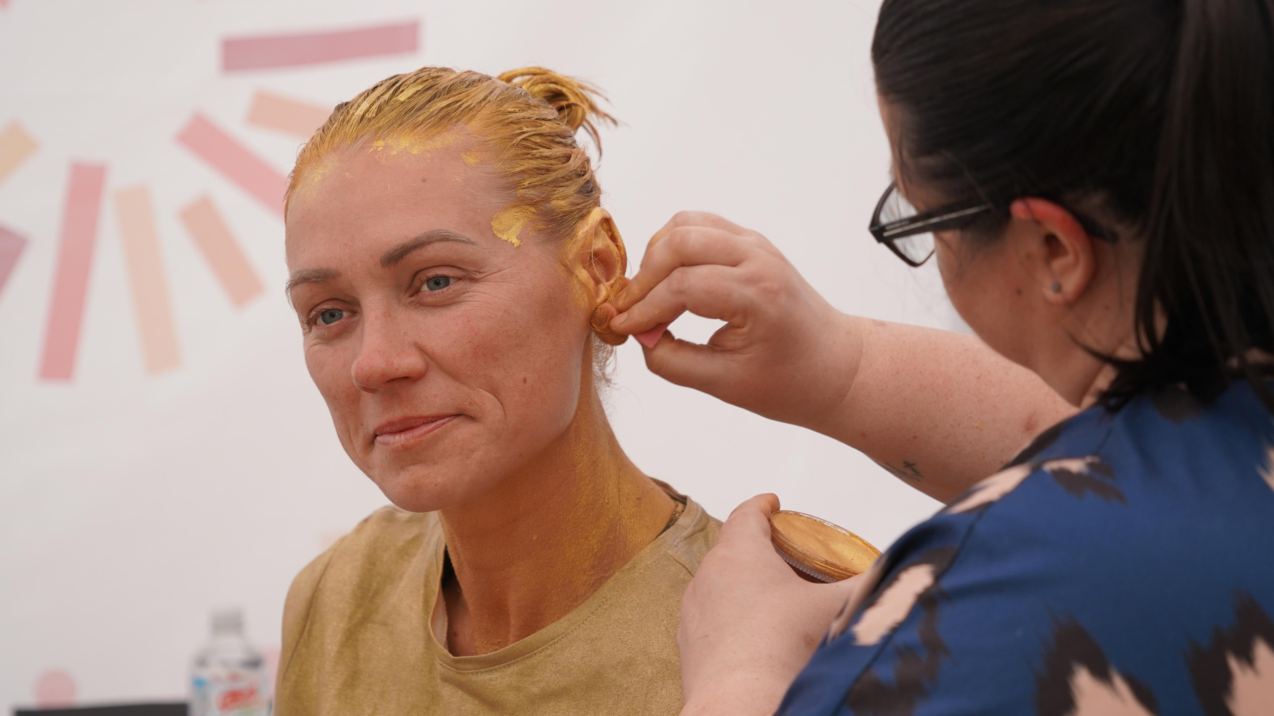 Homelessness is highlighted with body paint during public art display ...