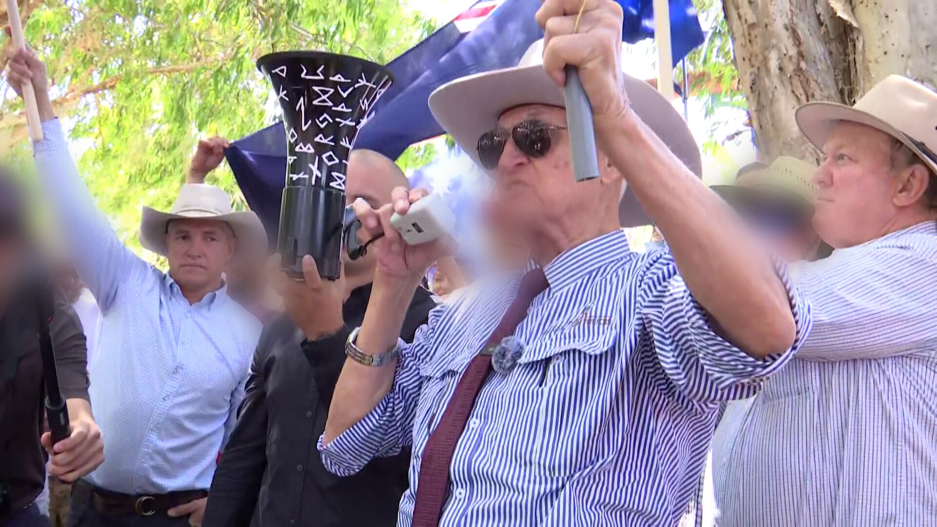 KAP leader says he was unaware man next to him at rally was wearing neo ...