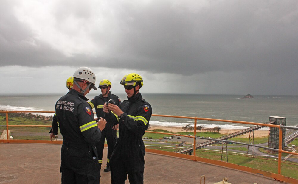 Firefighters step out of the flames and over the ledge for vertical ...