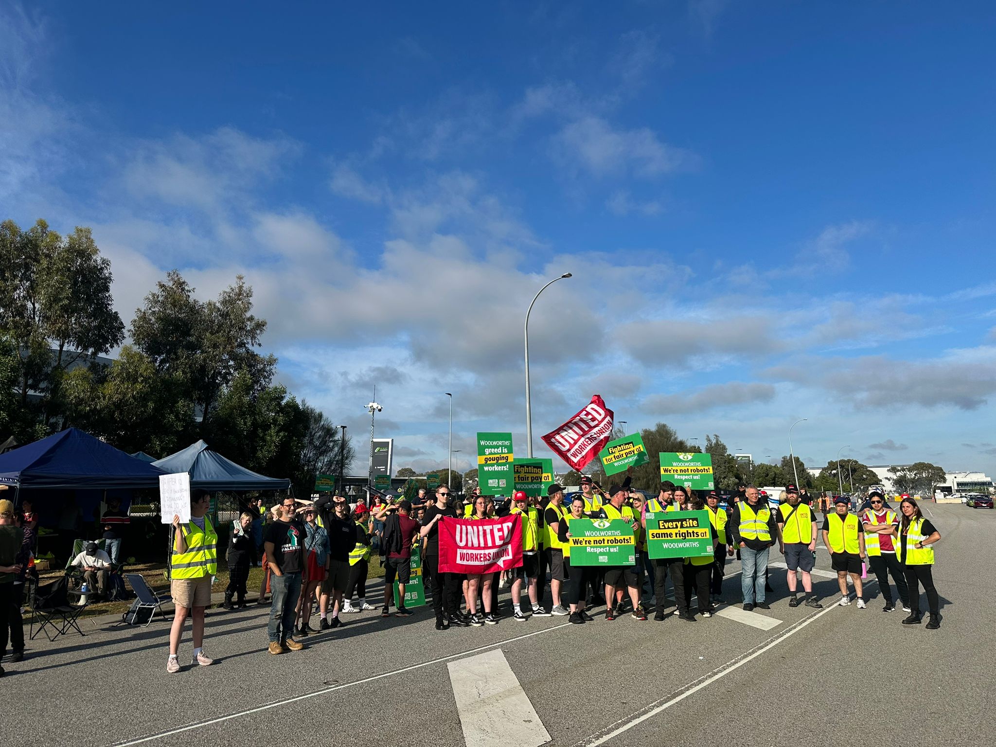 Woolies staff picket distribution centre as dispute reaches 11 days ...
