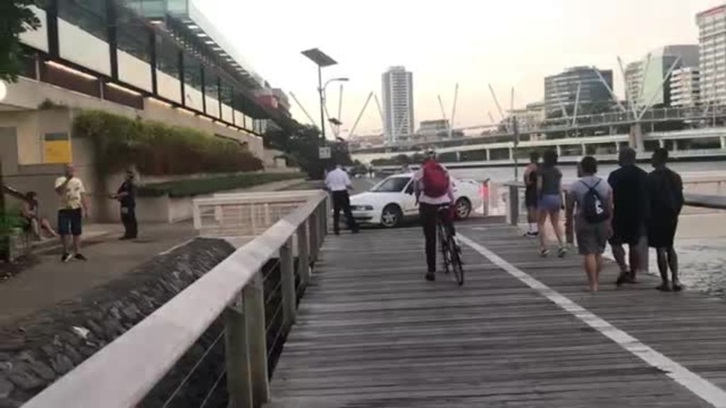 Police remove car from Brisbane pedestrian boardwalk - ABC News