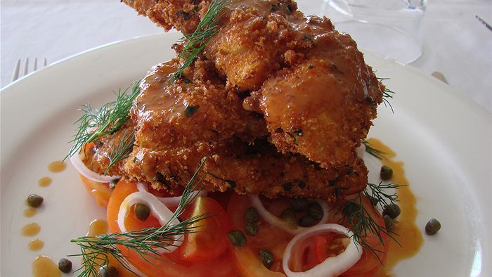 Crumbed coral trout, paprika veloute and tomato and caper salad - ABC News