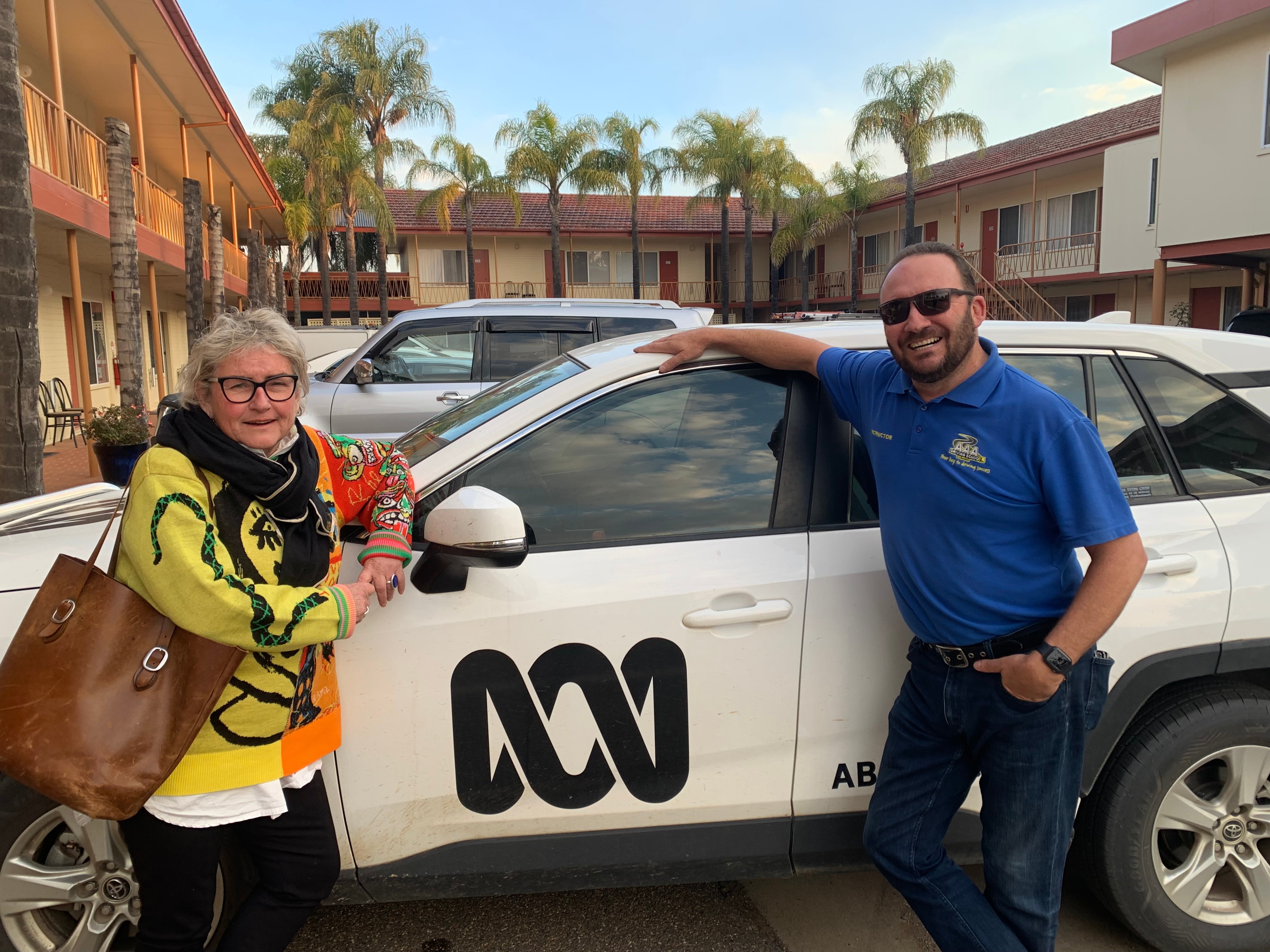 Griffith driving instructor Sandro Coledan checks Sally Bryant's skills ...