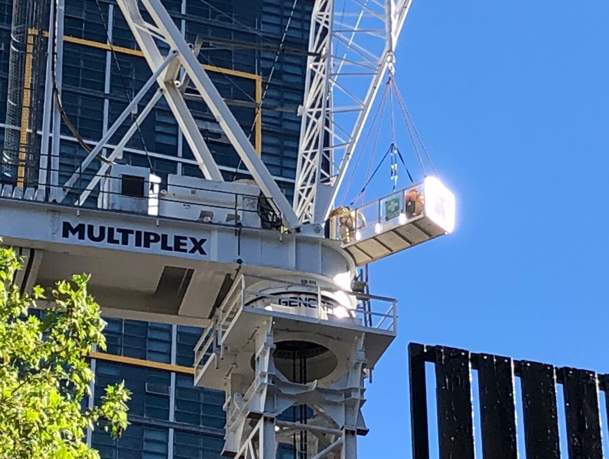 Crane driver suffers suspected spinal and leg injuries after fall at ...