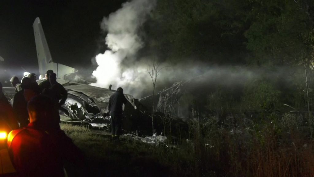 Rescue teams inspecting the plane crash wreckage in north-eastern ...