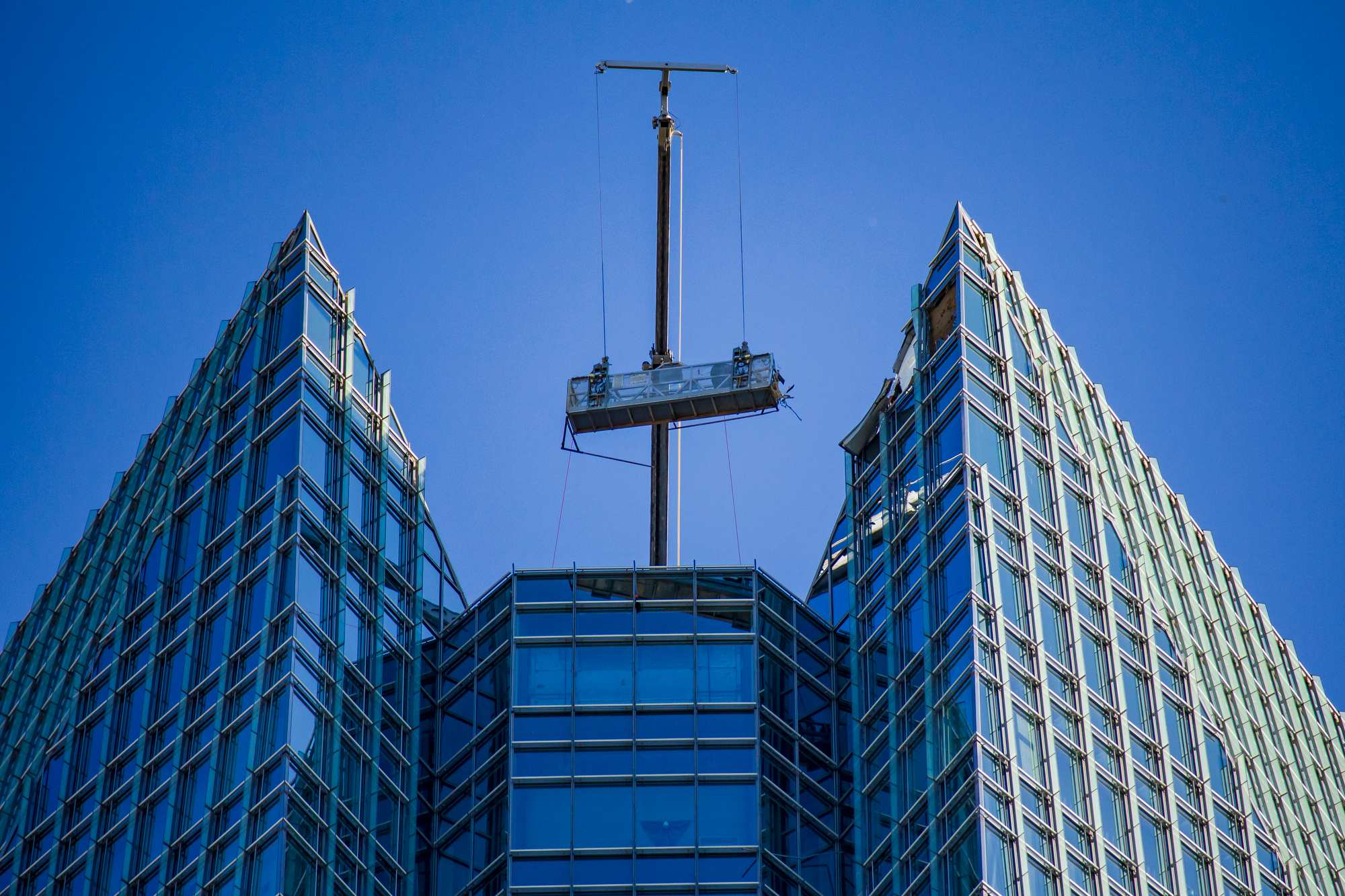 Window cleaners rescued from swinging scaffold atop 50-storey ...