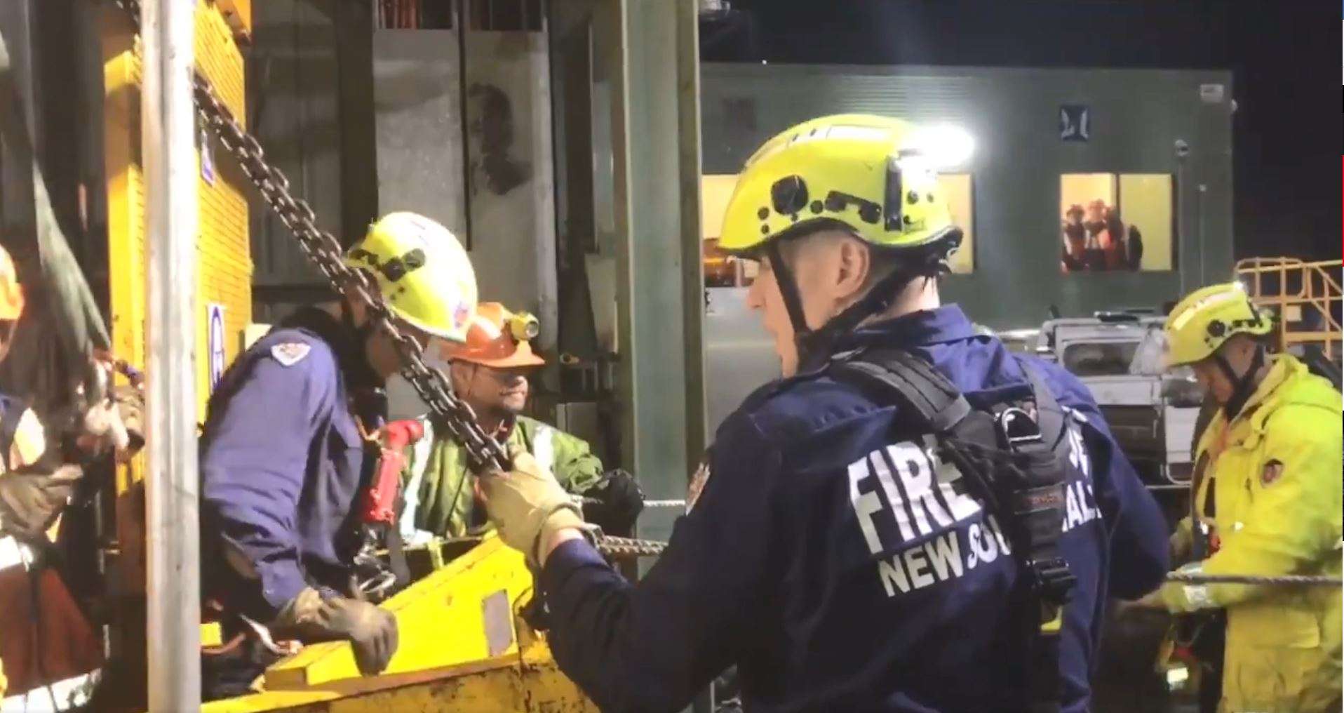 Miners walk free after being trapped in lift underground for nine hours ...