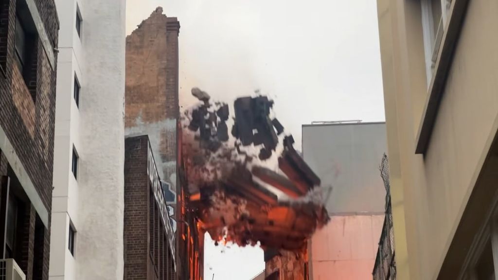 Wall collapses as massive fire engulfs seven-storey-building in Sydney ...