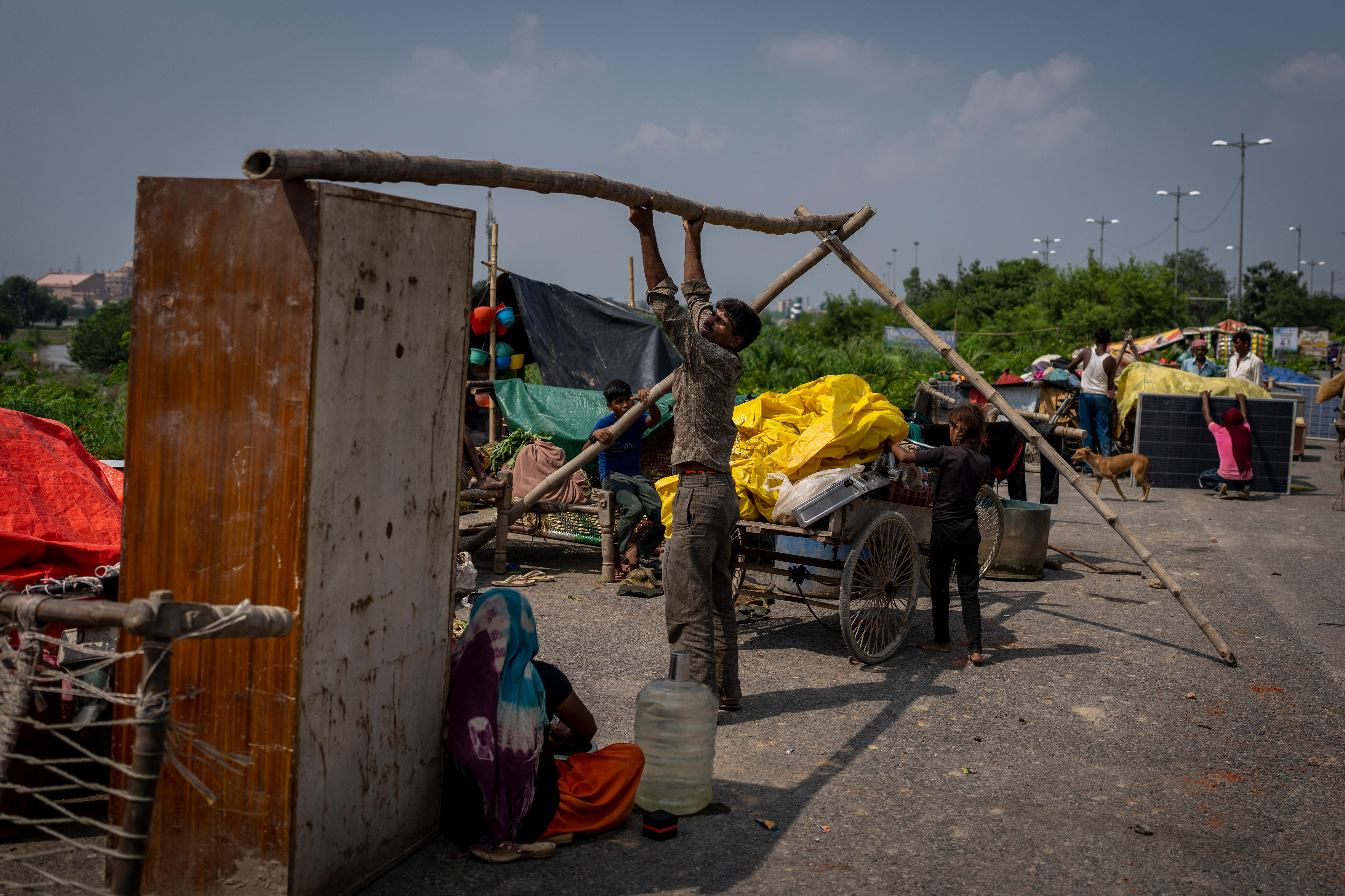 Fleeing floodwaters a way of life for families on banks of New Delhi's ...