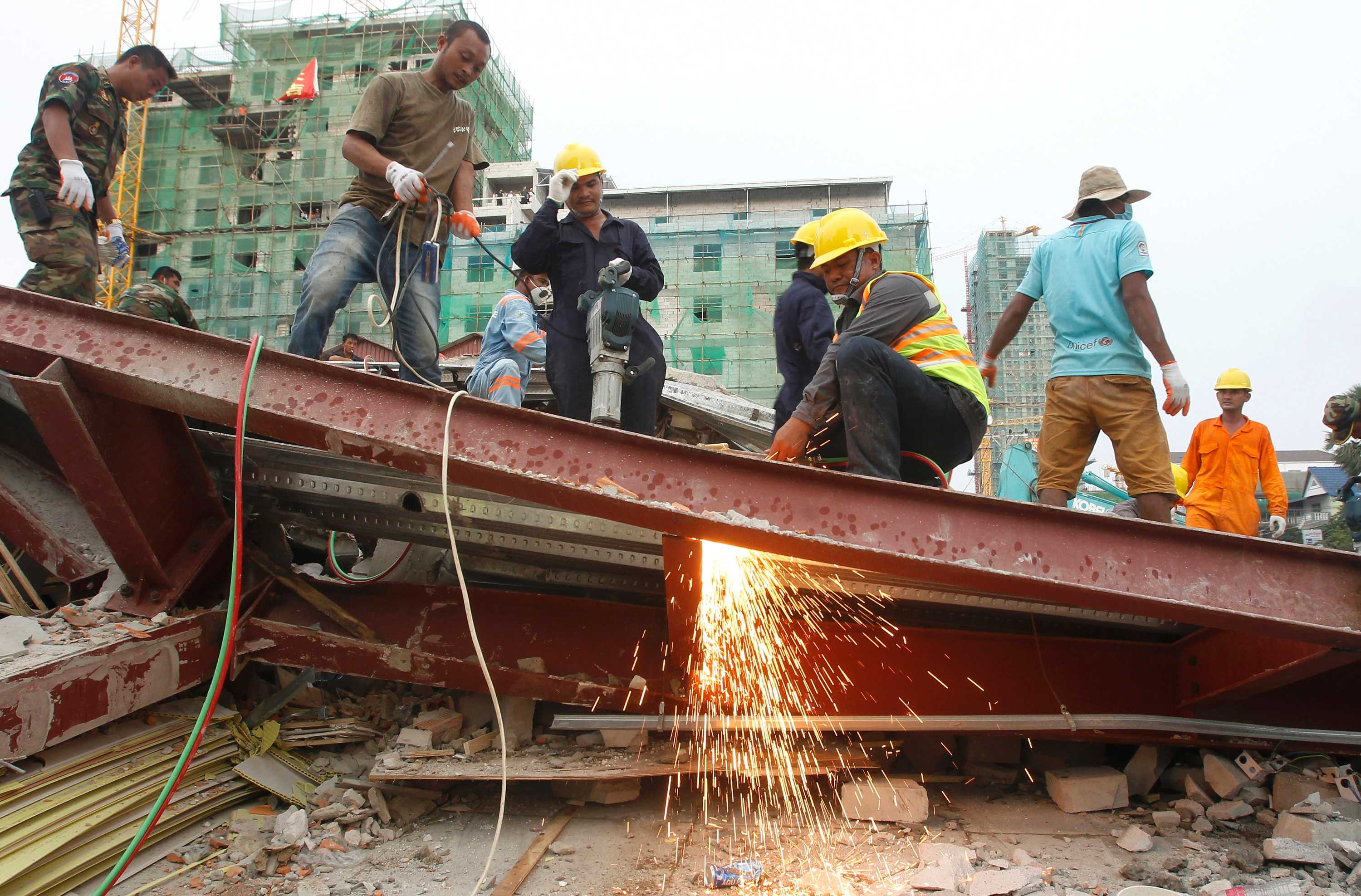 Cambodia building collapse survivors found as manslaughter charges laid ...