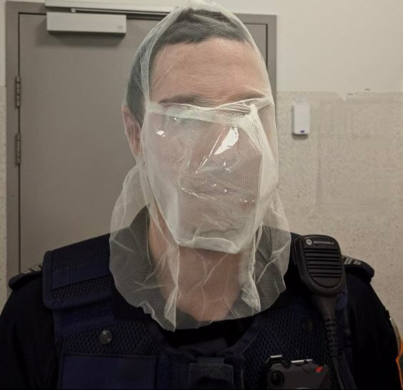 What is a spit hood and why do police and prison guards use them? - ABC News