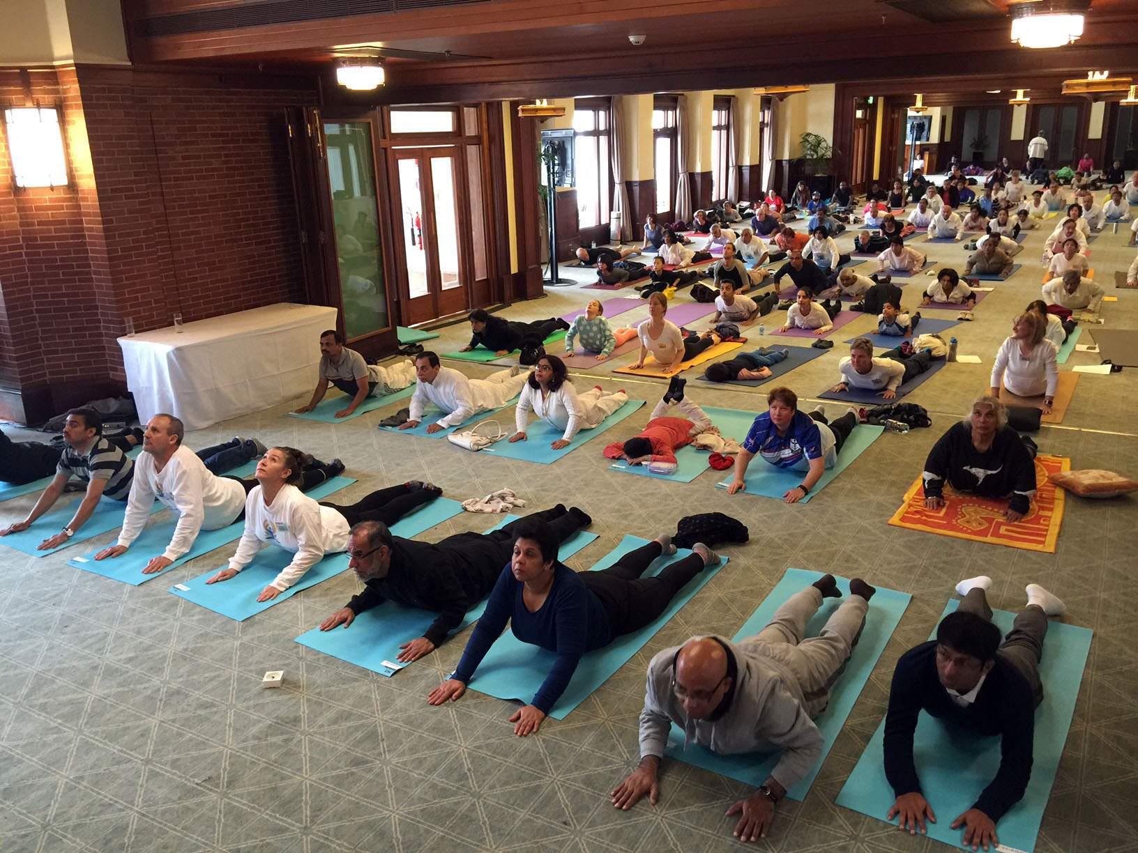 Scores of people roll out yoga mats at mass class in Indian High ...