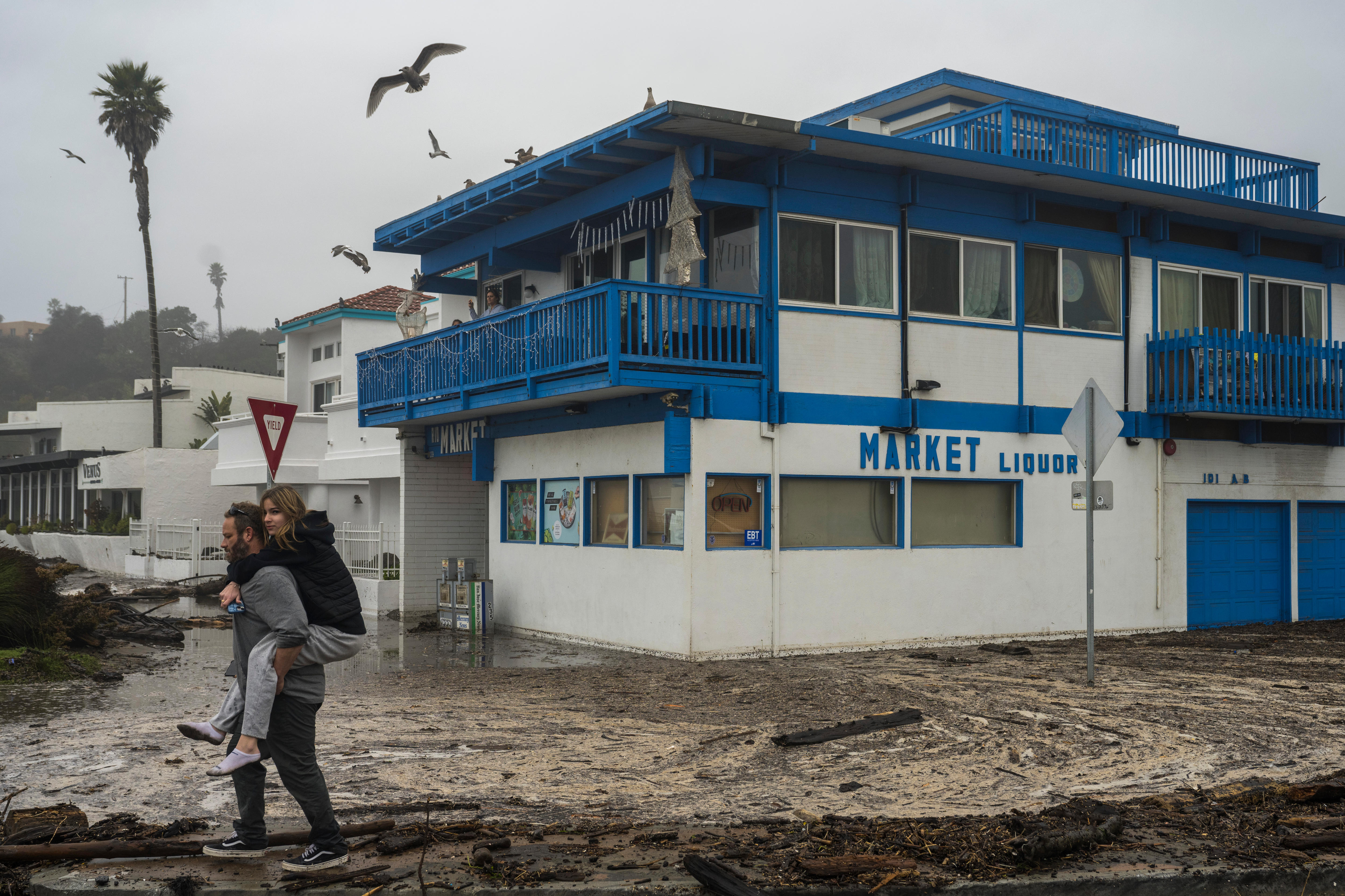 Pictures show destruction as huge surf pounds US West Coast, flooding ...