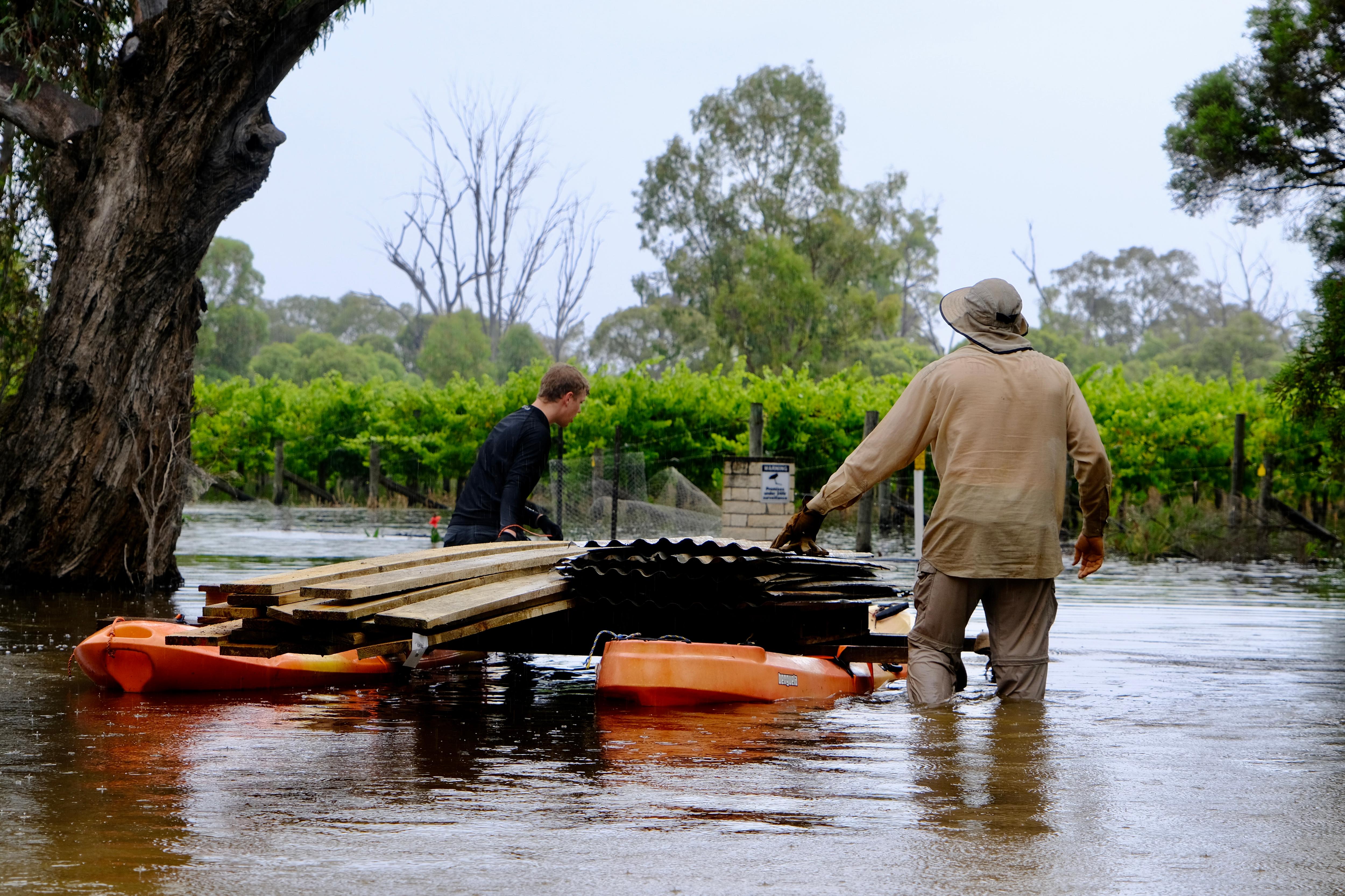 Riverland family waits out flooding, protected by makeshift levee ...