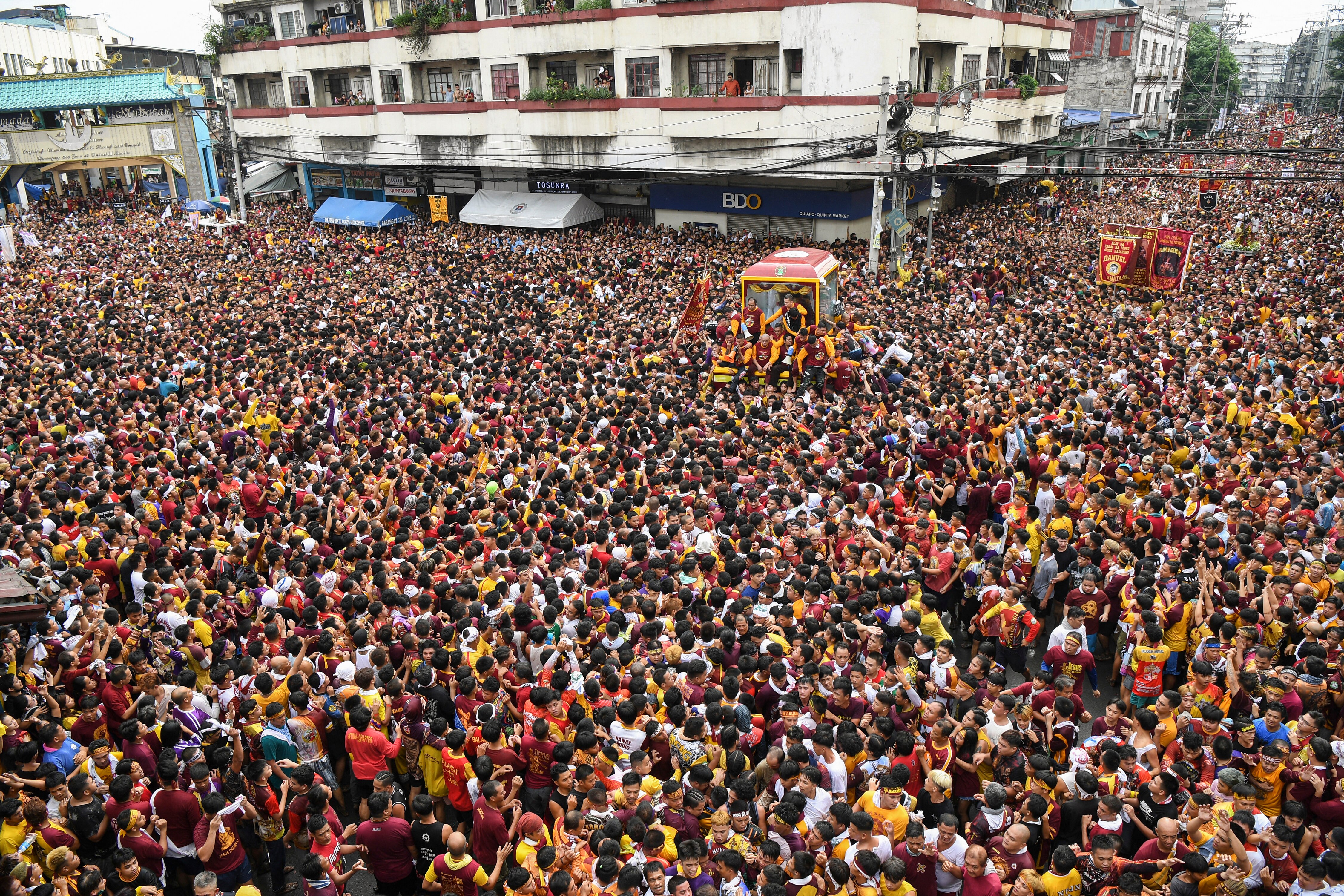 Massive crowds of Philippine Catholics swarm Black Nazarene statue as ...