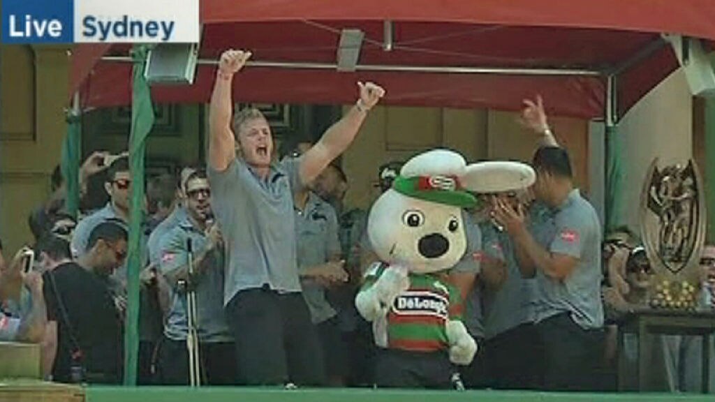 South Sydney Rabbitohs sing the team song after accepting keys to the ...
