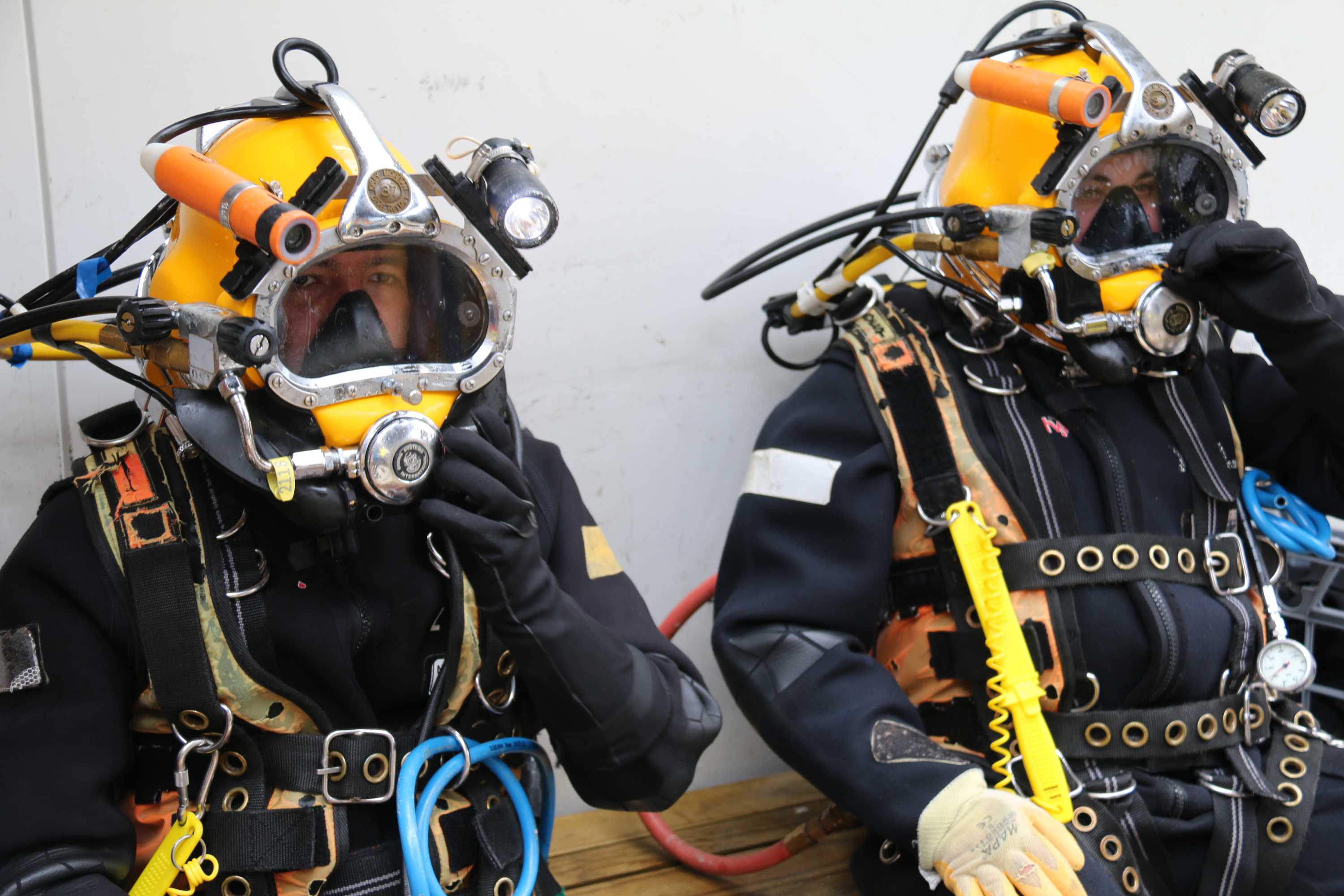 Divers train up to 100 metres below surface at remote Tasmanian lake ...