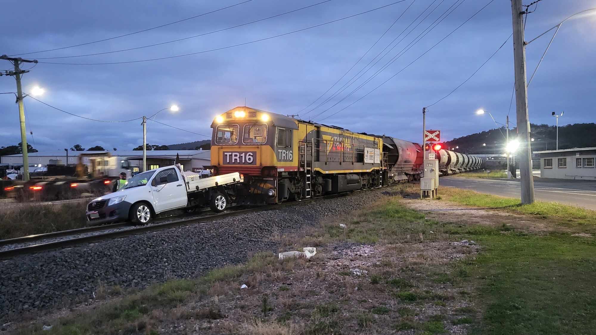 Man jumps free from car as train smashes into it at Devonport crossing ...