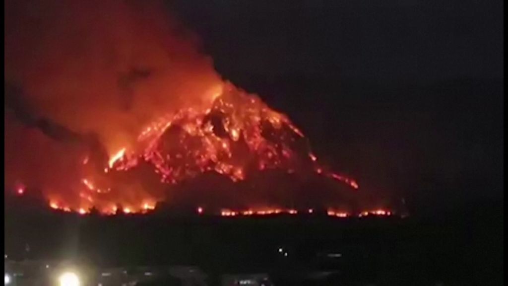 Wildfire rages across a mountain through Khao Laem National Park in ...