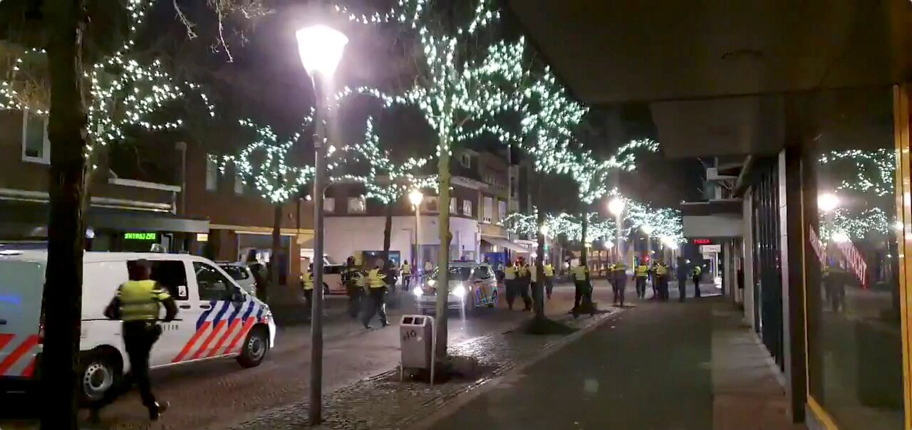 Dutch police arrest 184 people after third night of coronavirus curfew ...