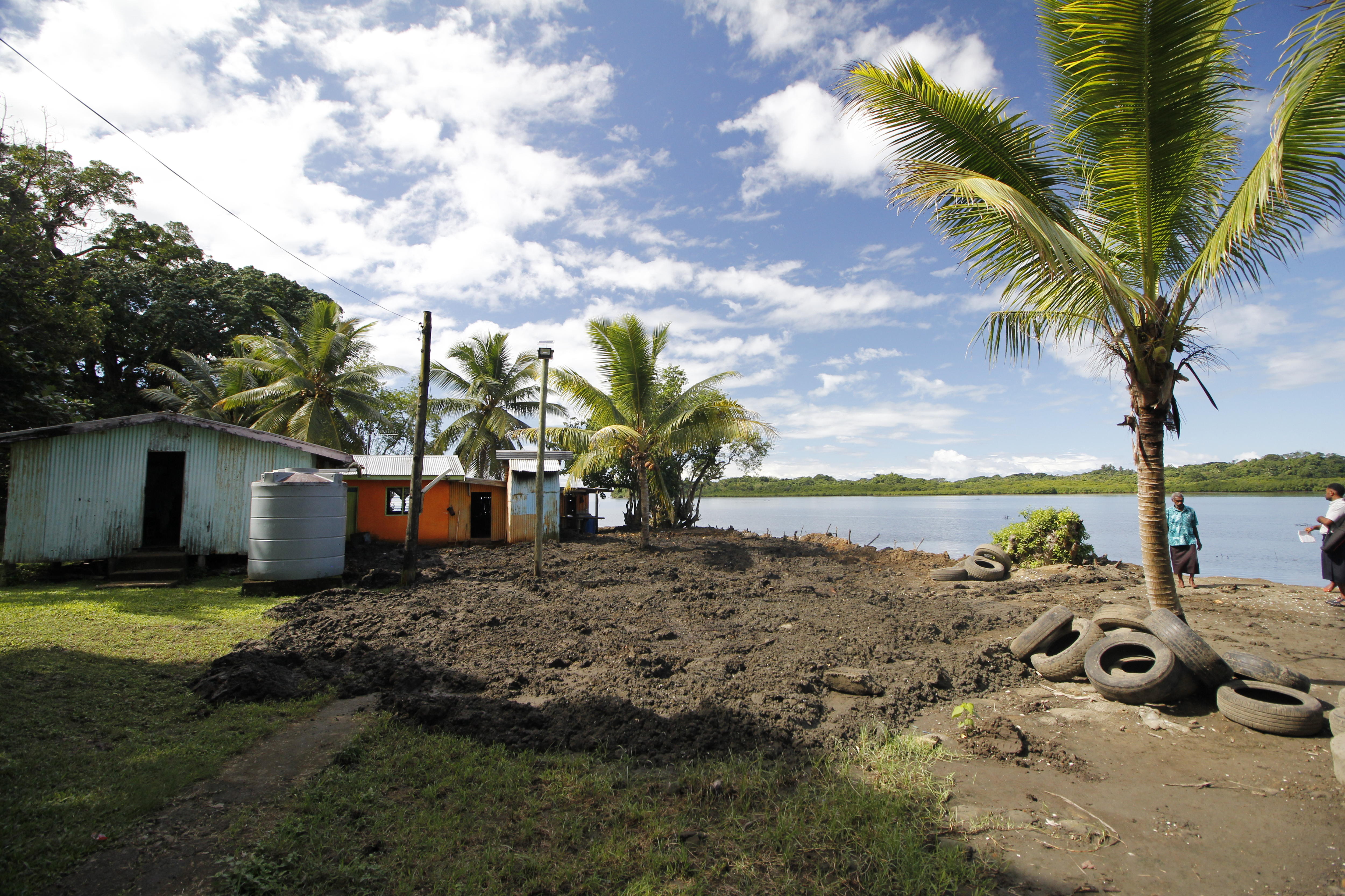 Fijian village acts in desperation to stop losing ground to rising sea ...