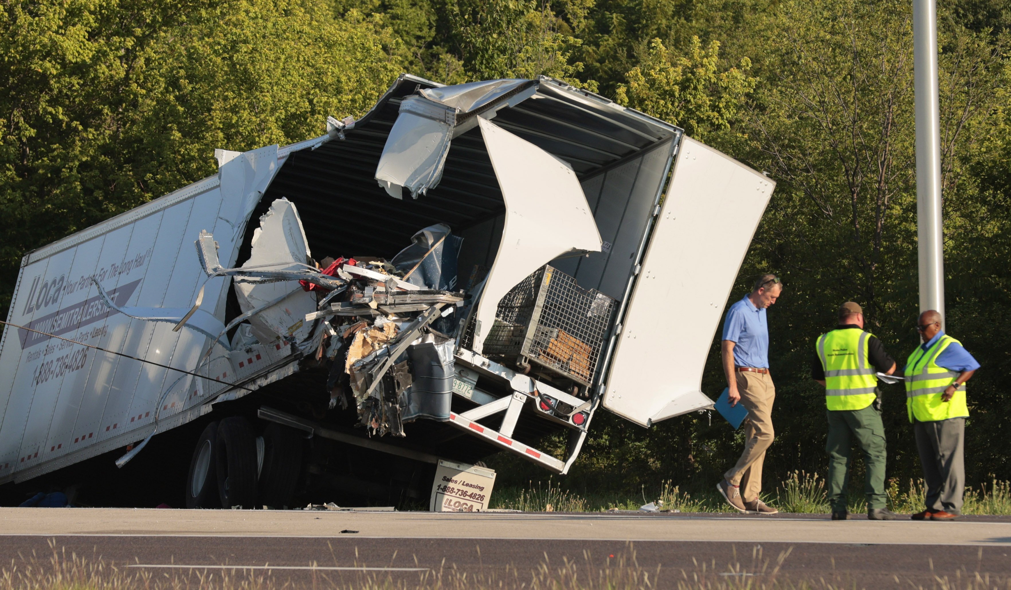 Three dead, 14 injured after bus crashes into truck trailers at highway ...