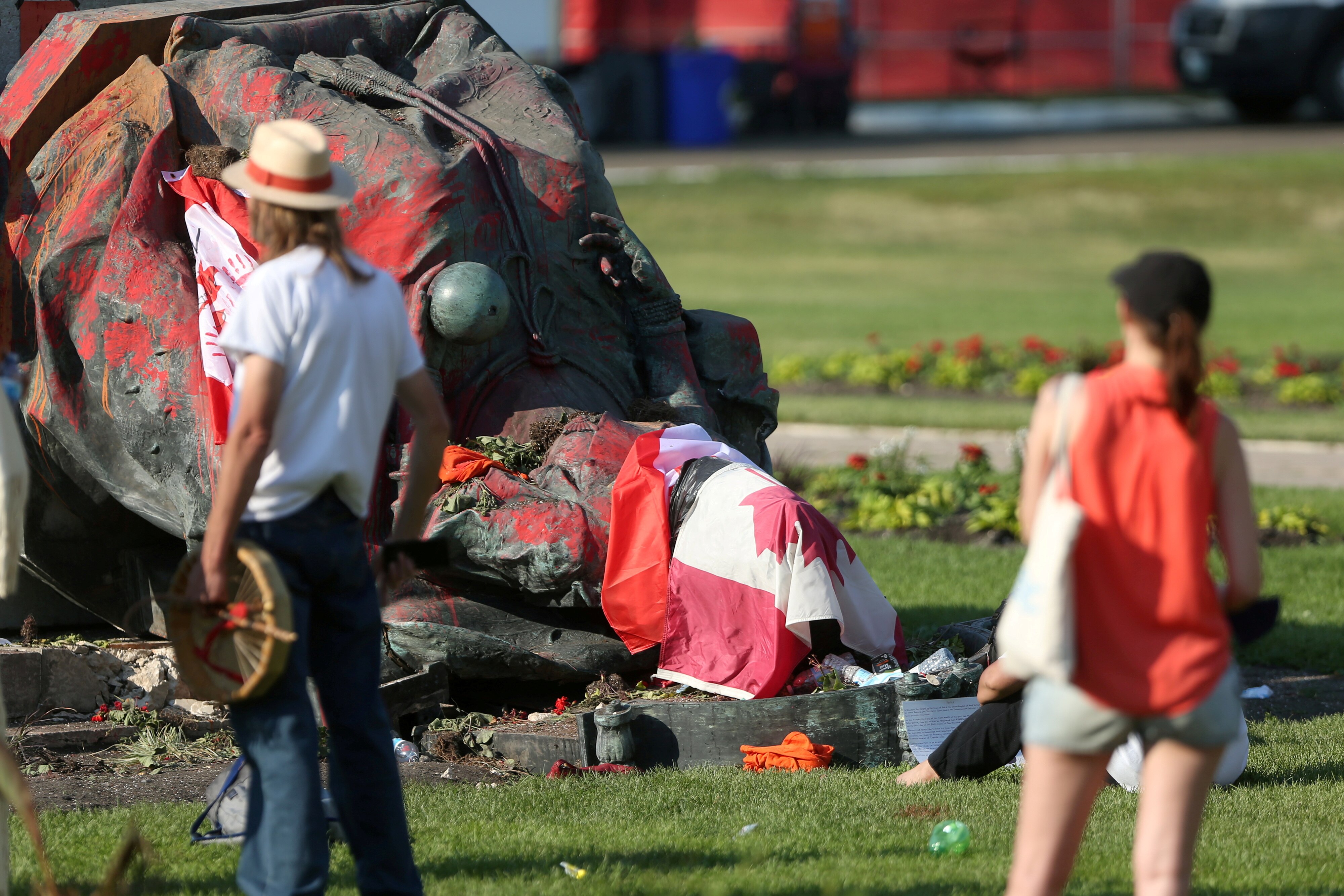 Canada Day protesters pull down statutes of Queen Victoria, Queen ...