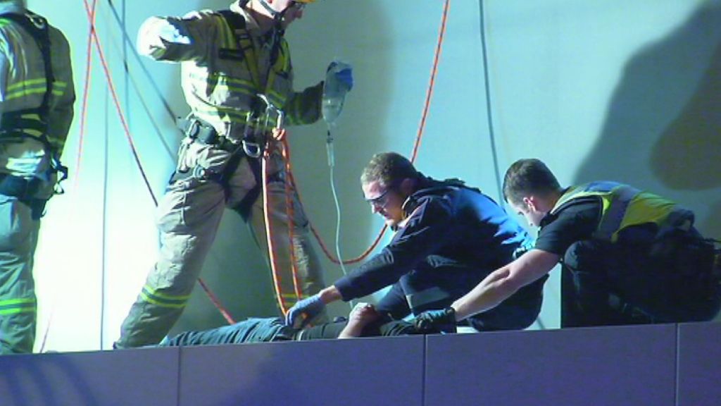 Man falls from multi-storey building while running from police in ...