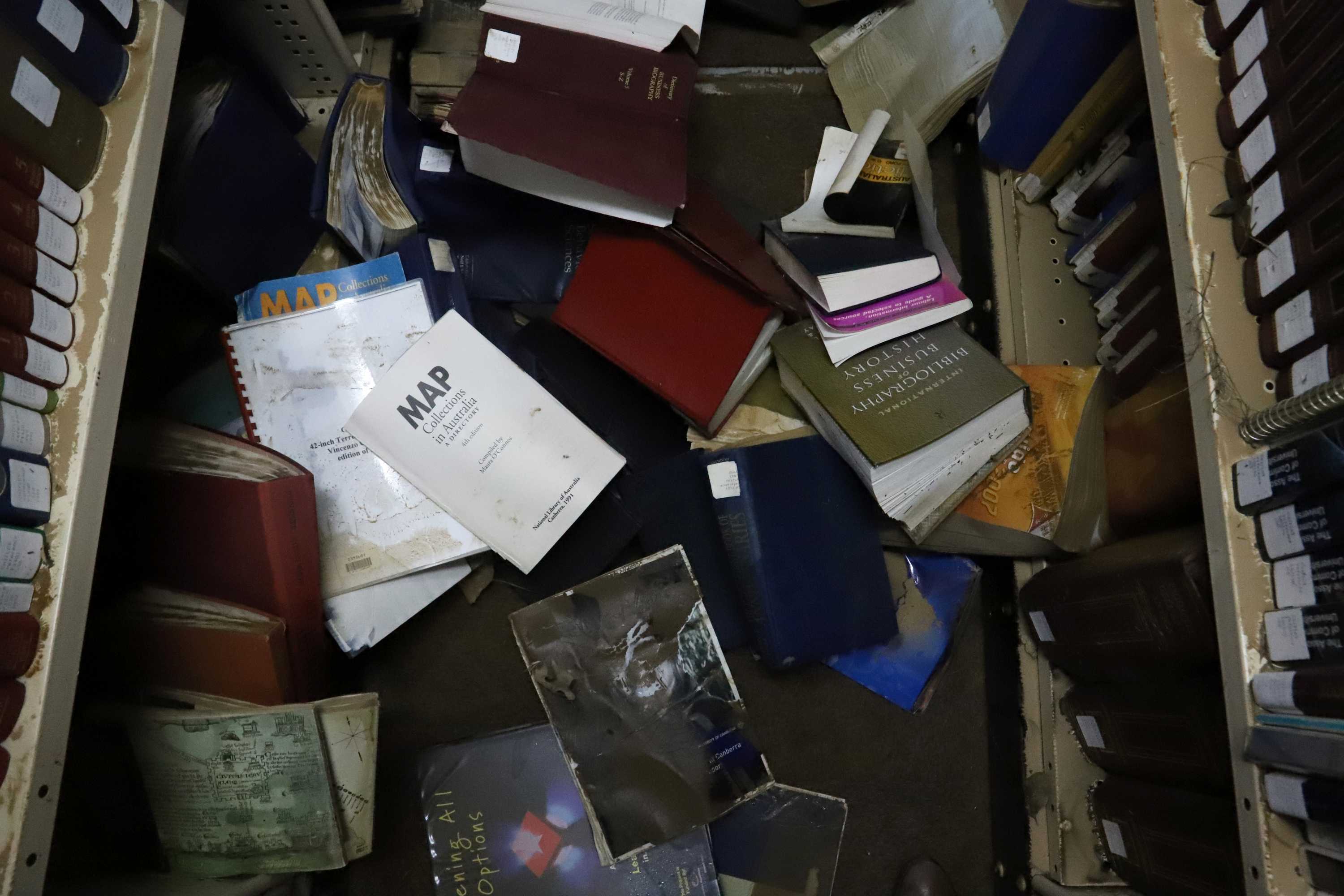 ANU librarians begin urgent salvage job after precious books, documents ...