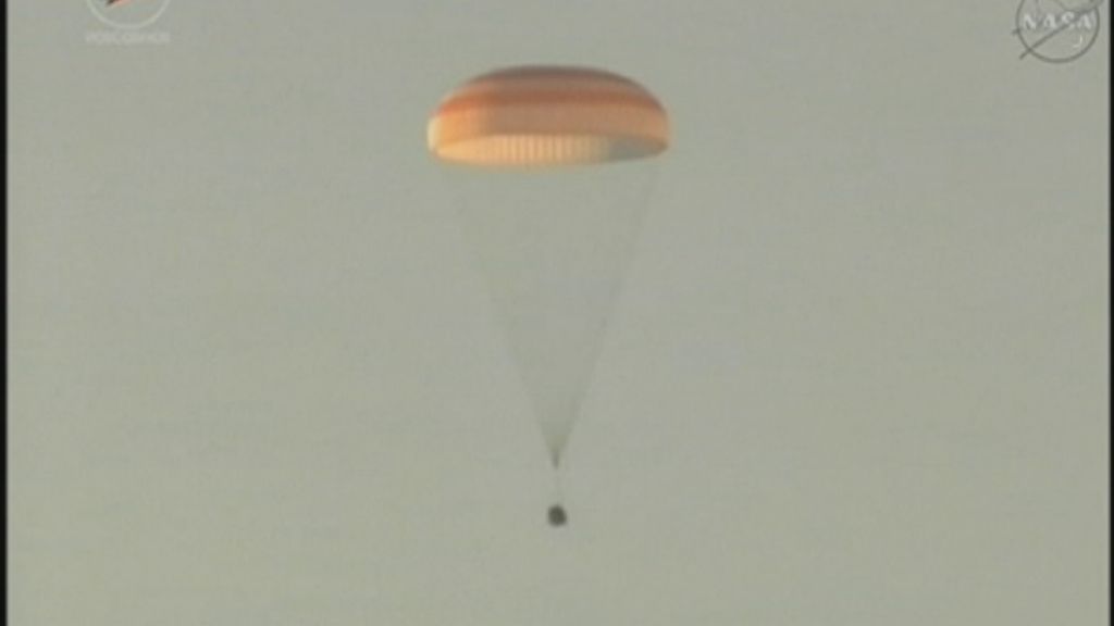 Astronauts land safely back on Earth in parachute landing - ABC News