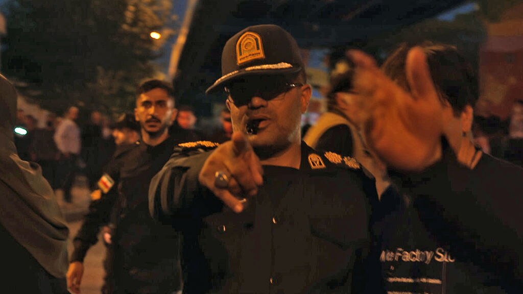 Iranian police surround Four Corners' crew in Tehran. - ABC News