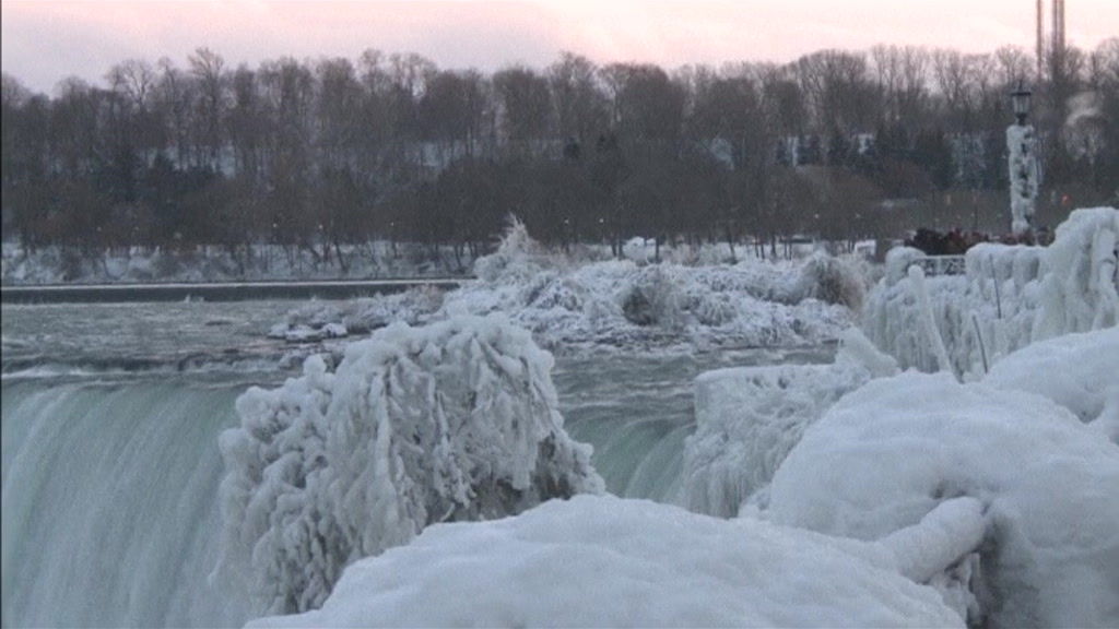 Niagara Falls partially freezes as cold snap continues in North America ...