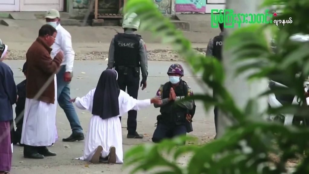 Myanmar nun kneels in front of police amid protests - ABC News