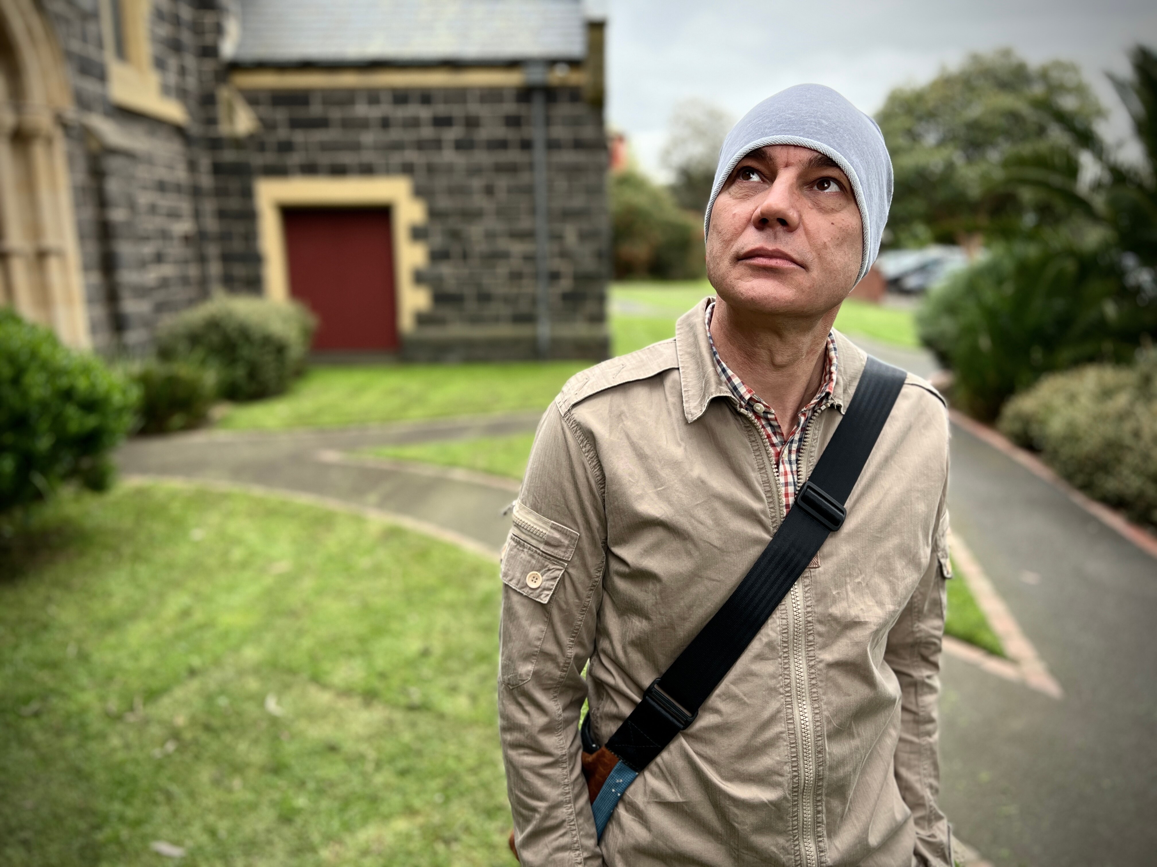 Adrian Ristau walks past church - ABC News