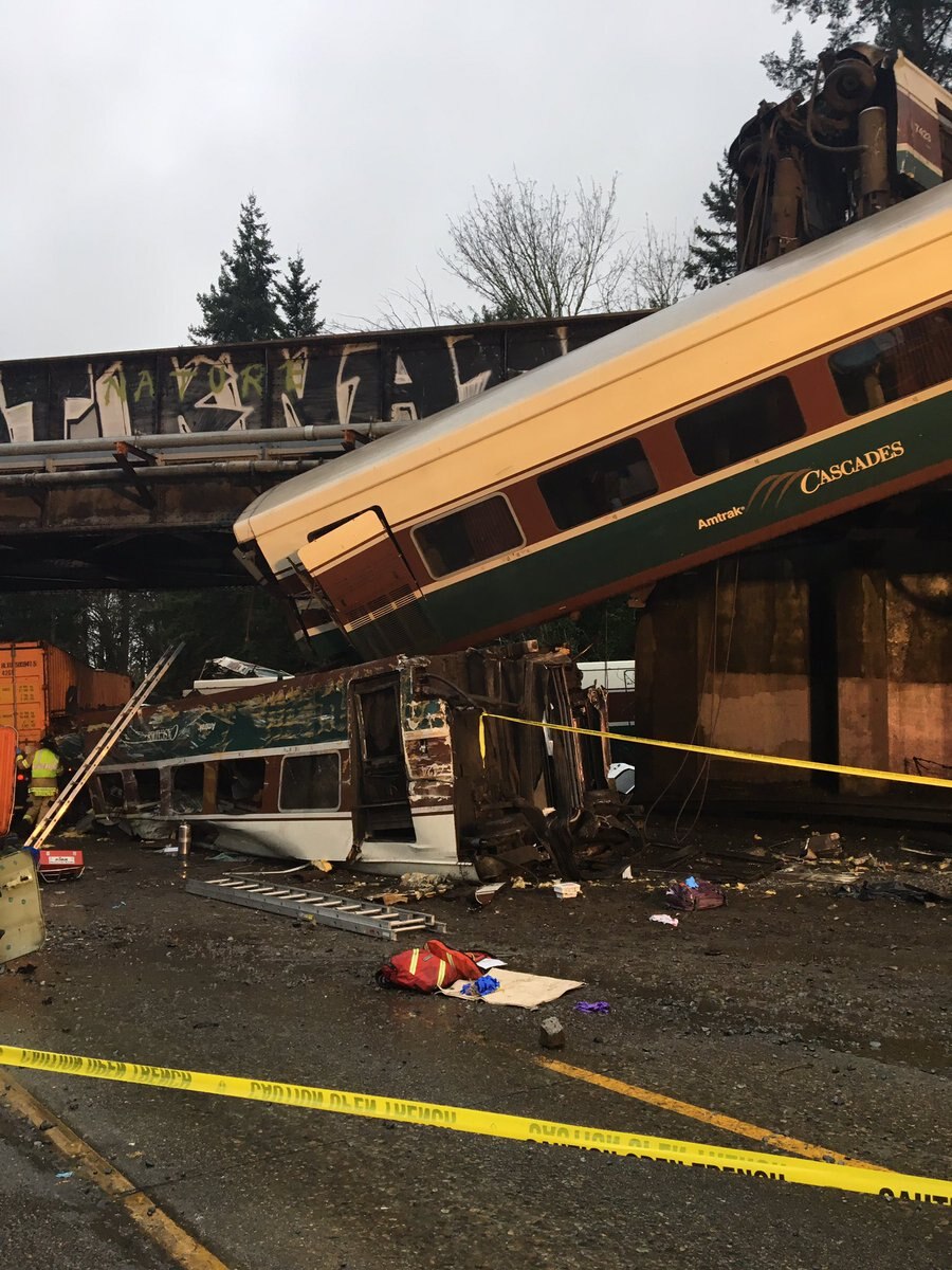 Amtrak train plunges from bridge over Washington state highway killing ...